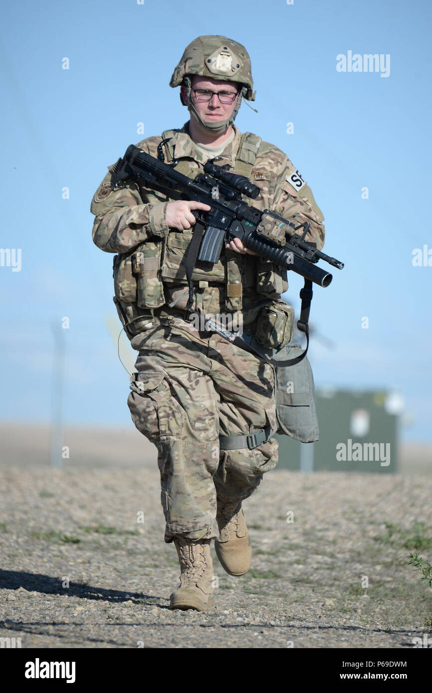 U.S. Air Force Senior Airman Christopher Freeman, runs into position ...