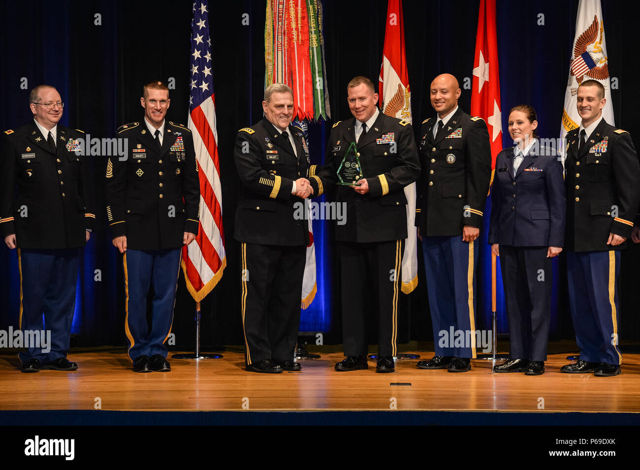 Chief of Staff of the U.S. Army Gen. Mark A. Milley presents an award ...