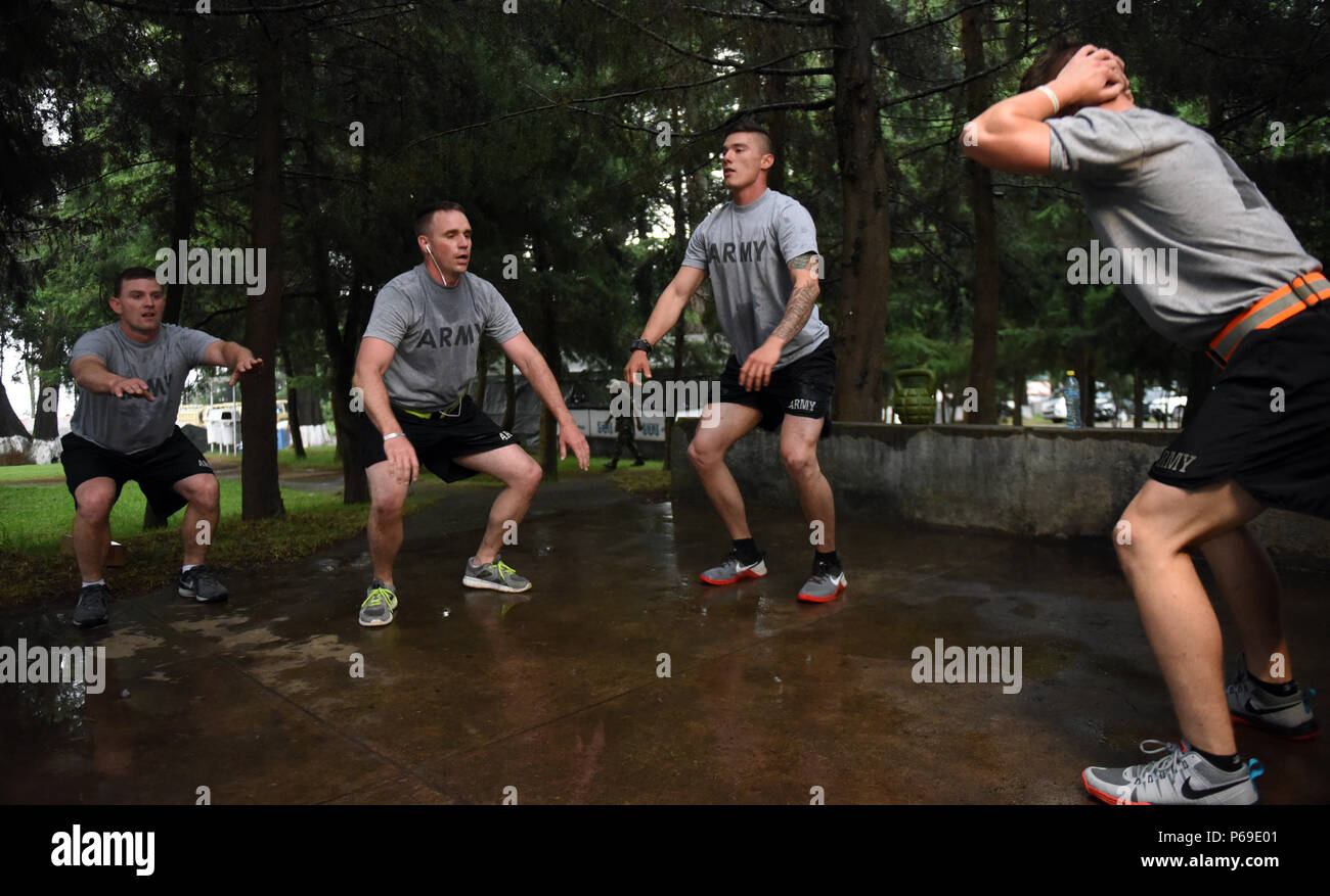 U.S. Soldiers competing in the MURPH Challenge perform squats during ...