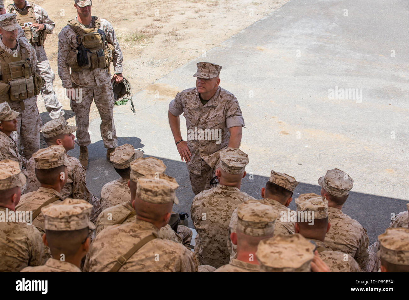 General Robert Neller, the Commandant of the Marine Corps, takes a knee ...