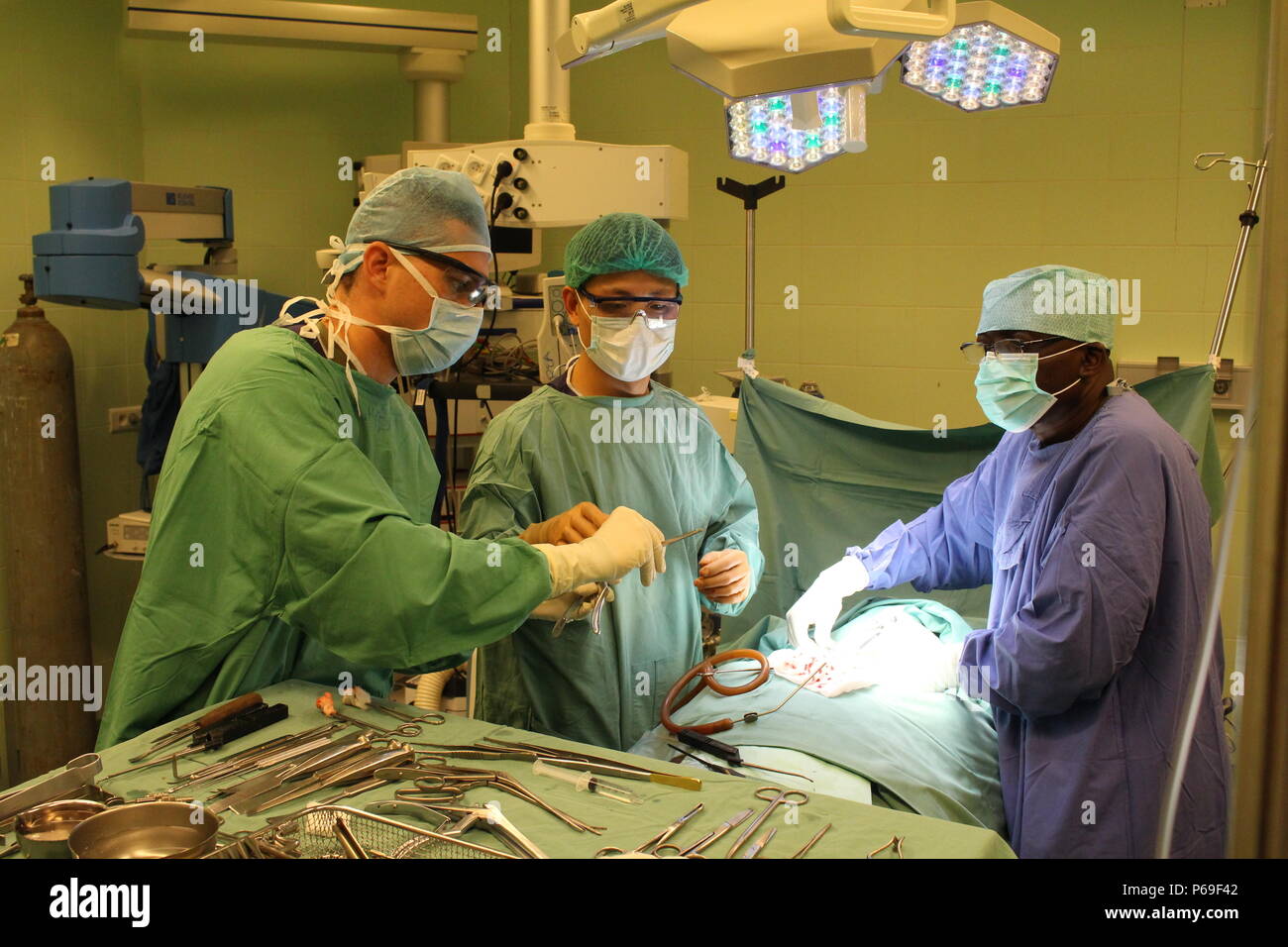 U.S. Army Sgt. Nicholas Bankston, left, an operating room technician ...