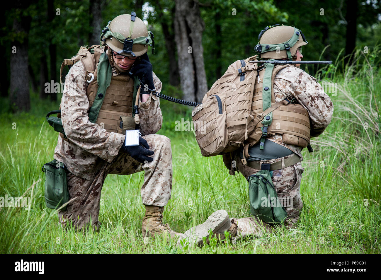 U.S. Marines attending the Military Police Basic Course, use a field ...