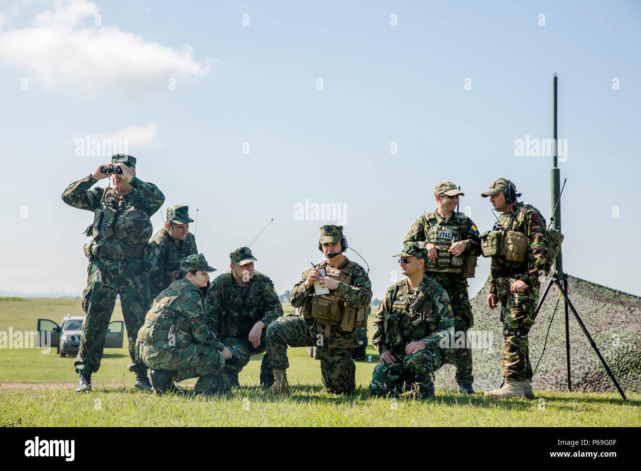 U.S. Marine Corps Capt. Russell E. Davis, center, an air officer with ...