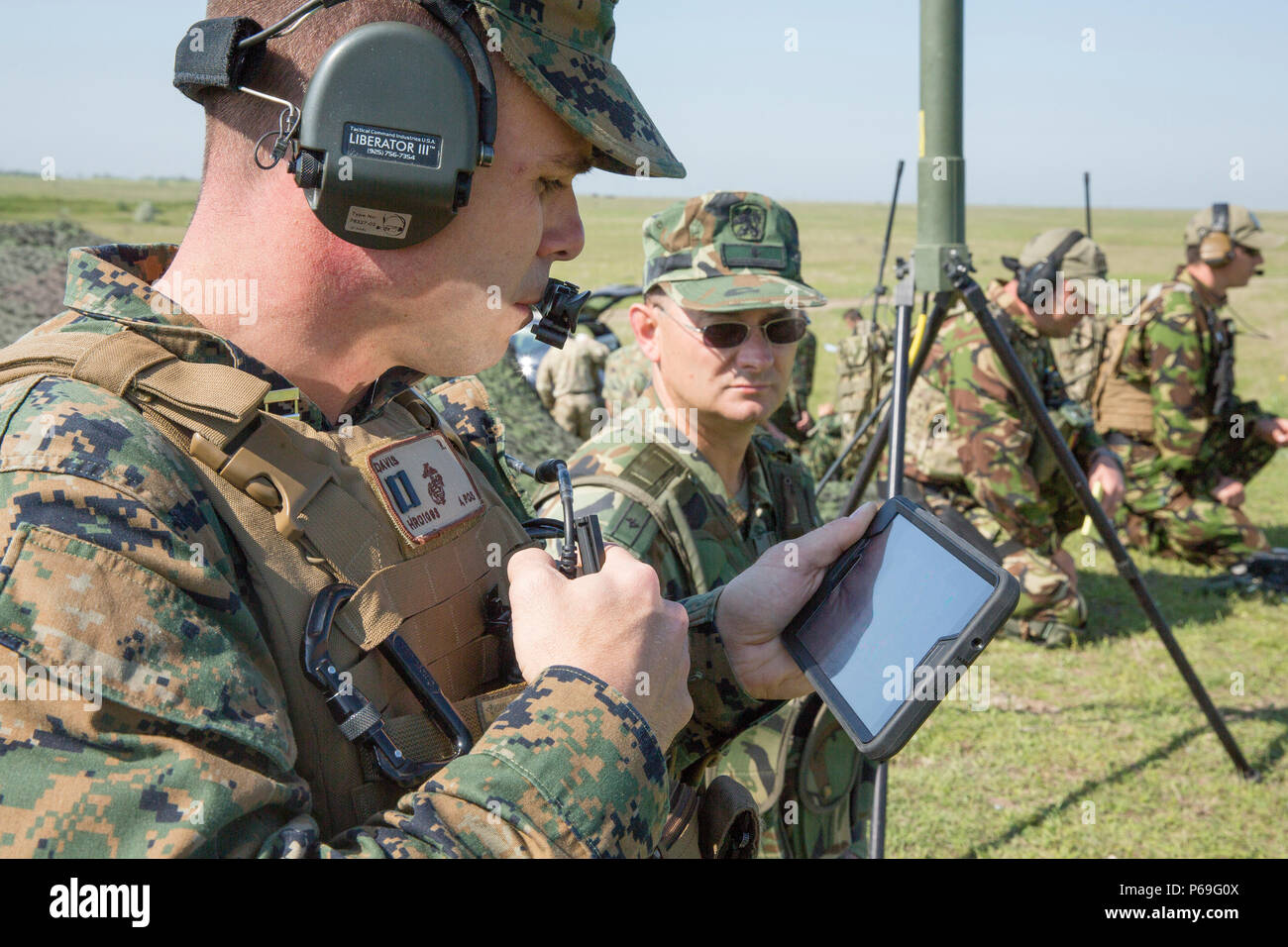 U.S. Marine Corps Capt. Russell E. Davis, left, an air officer with ...