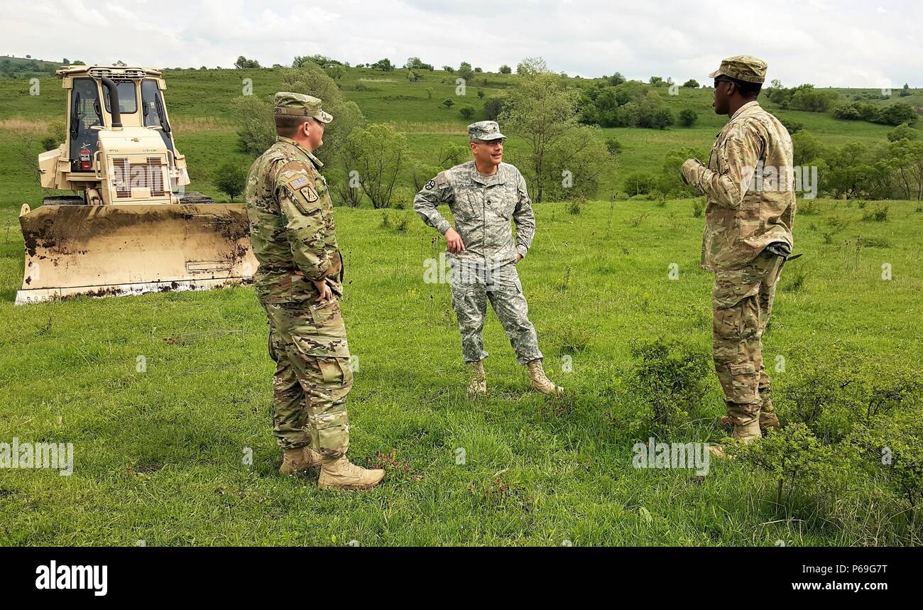 Spc. Riley Hughes (left), a surveyor assigned to 877th Engineer ...