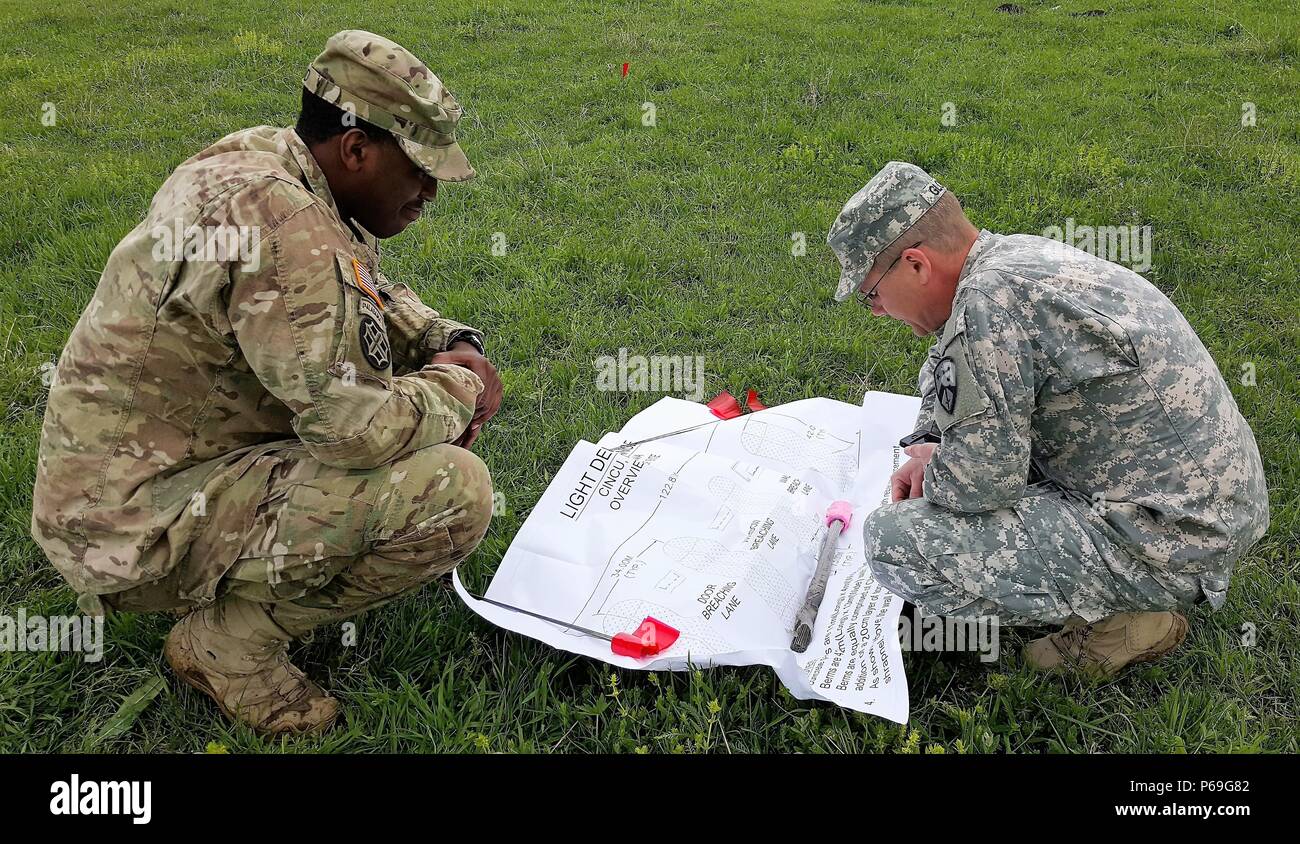 Sgt. 1st Class Terry Glover, a civil engineer assigned to 194th ...