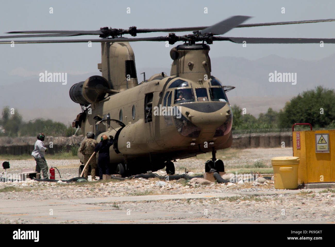 A U.S. Army CH-47 Chinook helicopter receives a hot refuel at Forward ...