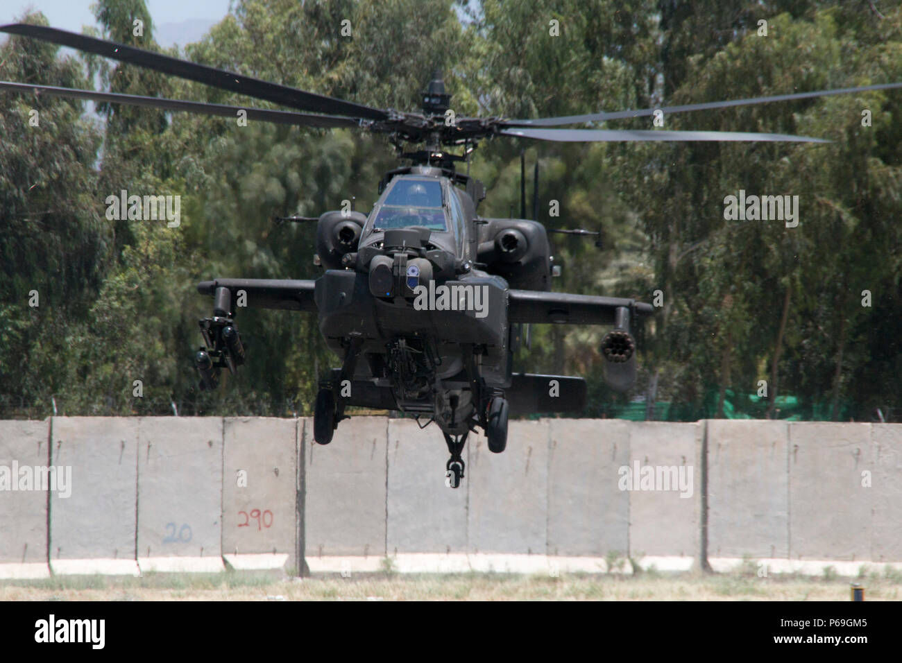A U.S. Army AH-64 Apache helicopter flies to a Forward Arming and ...