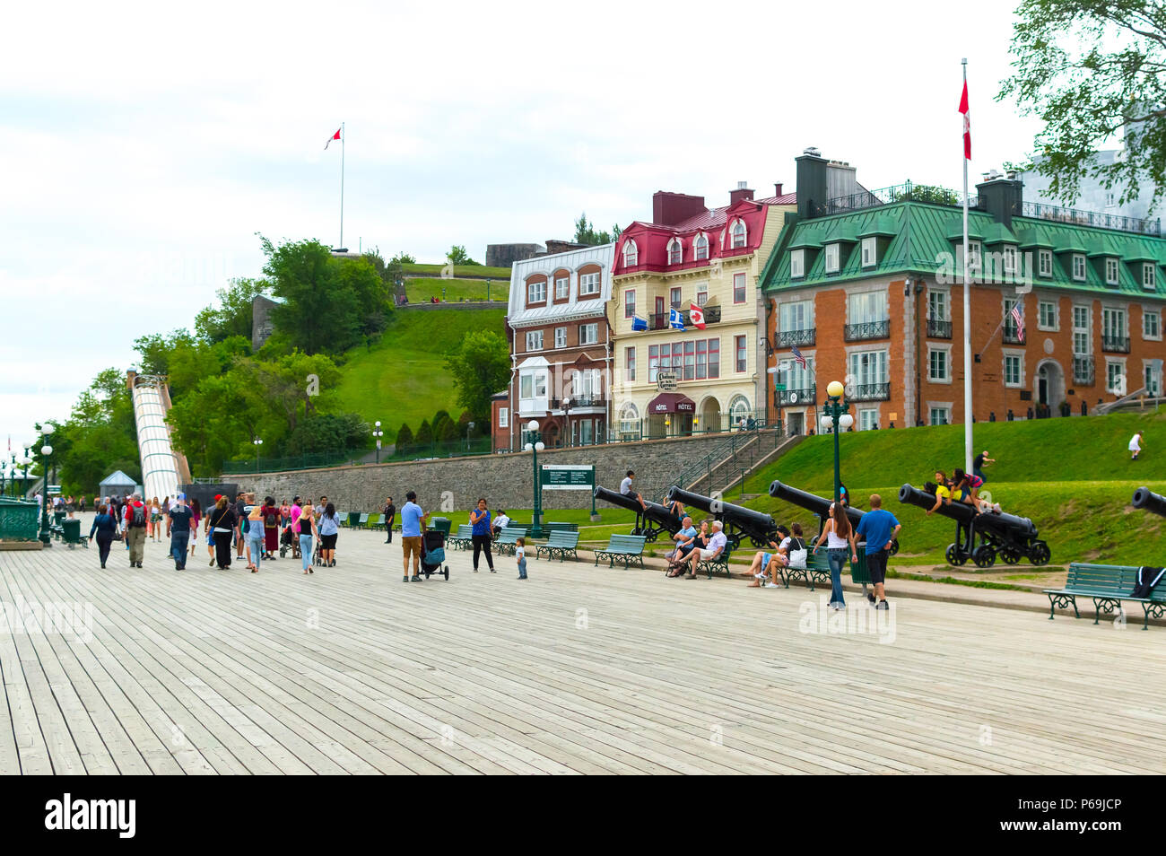 Quebec City, Quebec, Canada - June 23, 2018: Pedestrian exploring ... Quebec City, Quebec, Canada - June 23, 2018: Pedestrian exploring ...