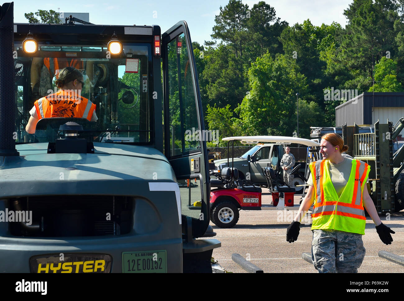 U.S. Air Force Senior Airman Branilin Grant guides Airman 1st Class ...