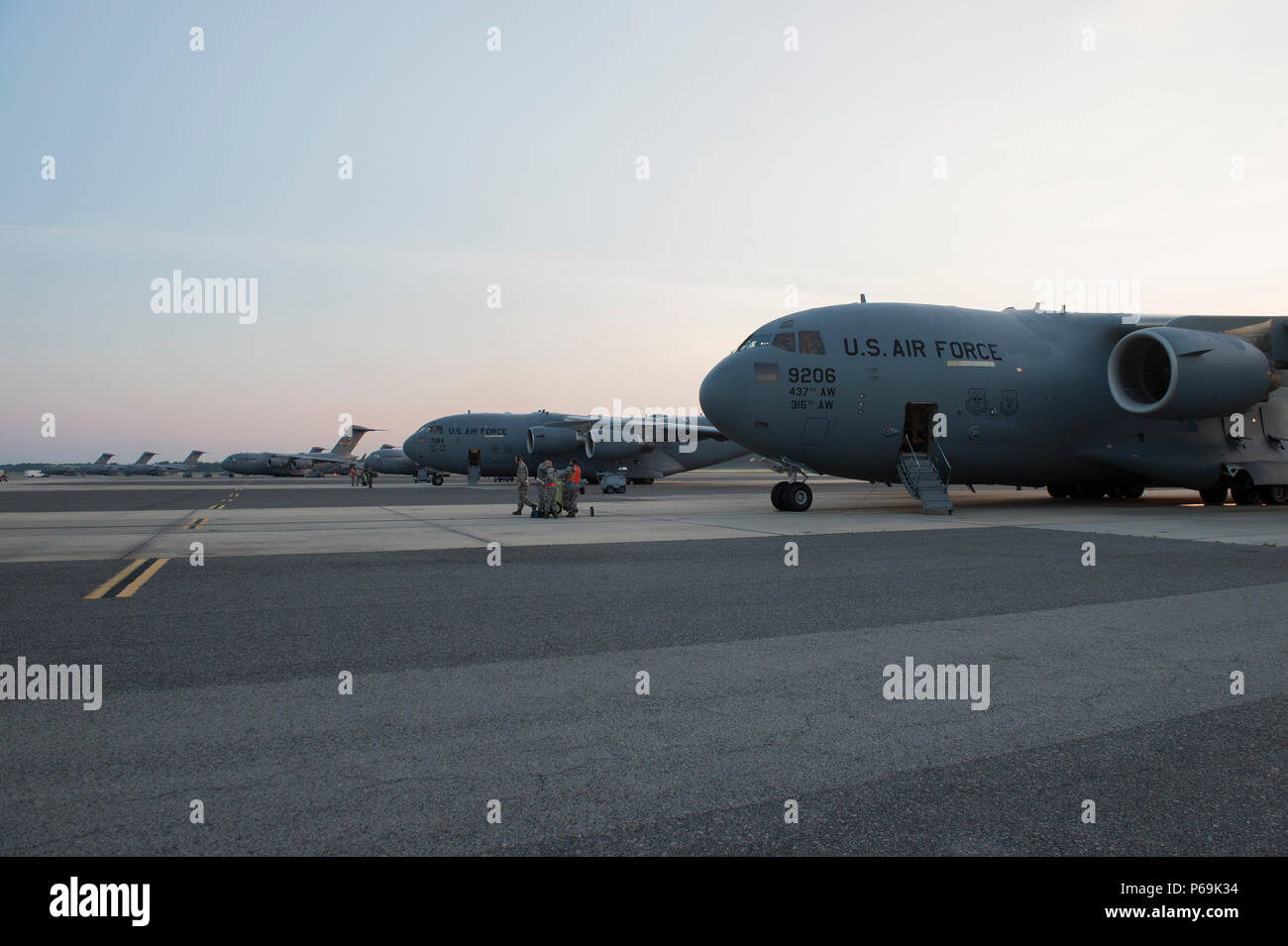 U.S. Air Force C-17 Globemaster IIIs sit on the Military Ramp prior to ...