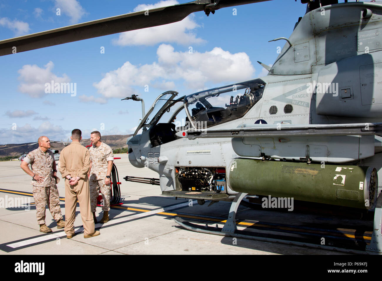 U.S. Marines Capt. Mackenzie T. White, second left, the assistant ...