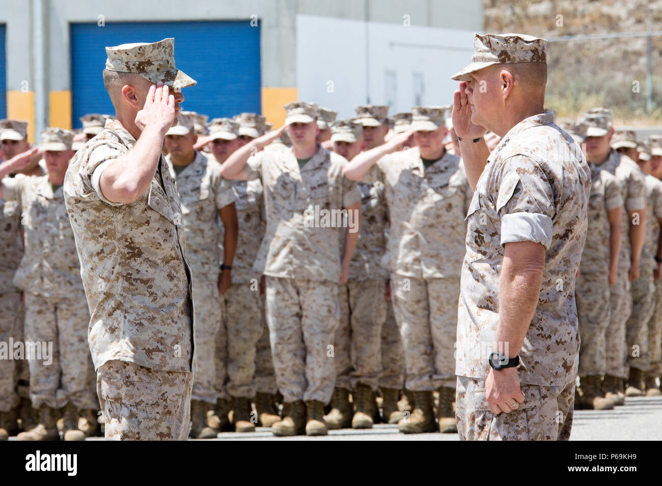 Commandant of the Marine Corps, Gen. Robert B. Neller, salutes a Marine ...