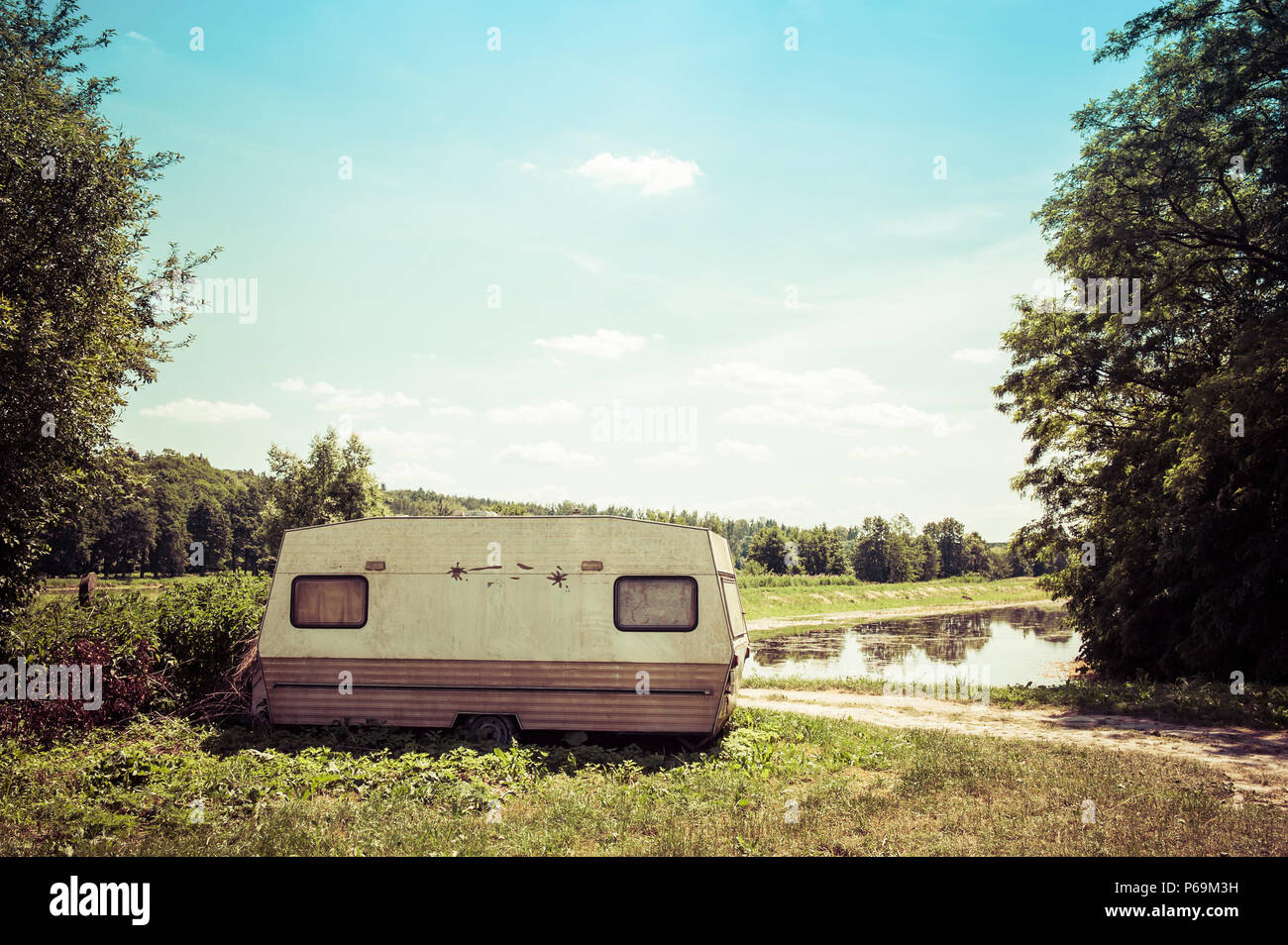 abandoned caravan standing on the side of the road Stock Photo - Alamy