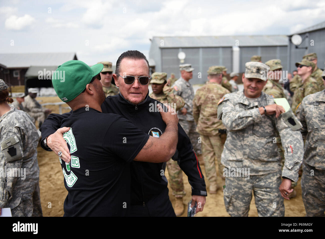 Actor Robert Patrick with service members at Camp Bondsteel, Kosovo, as ...