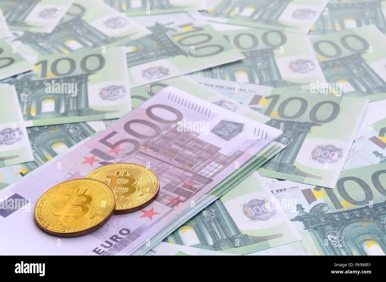 Golden physical bitcoins is lies on a set of green monetary ...