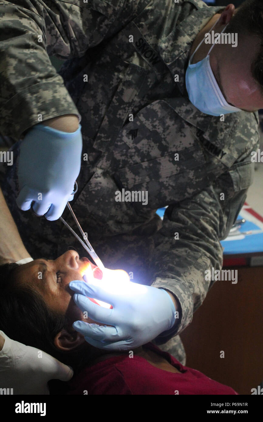 U.S. Army Sgt. Shelby Snow applies sutures to a Nicaraguan woman after ...