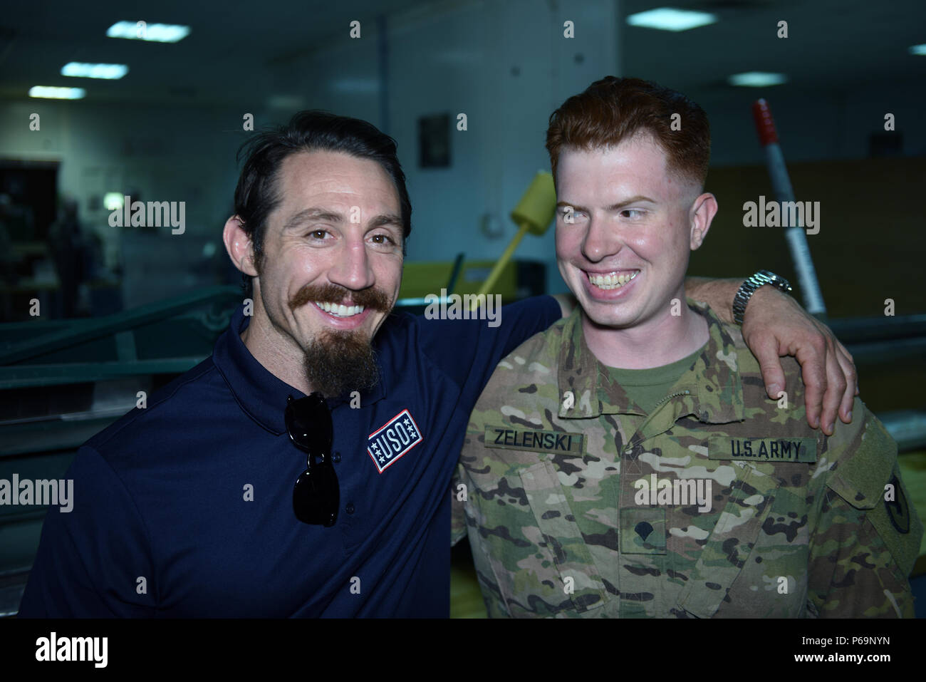 UFC fighter Tim Kennedy poses with a Soldier as Army Gen. Frank Grass ...