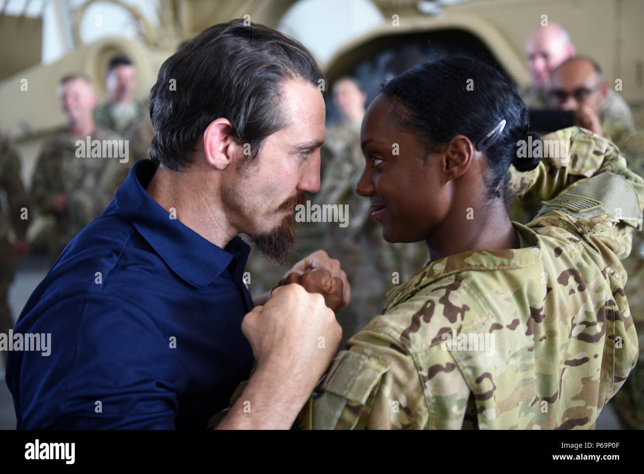 UFC fighter Tim Kennedy faces off with a soldier during a troop visit ...