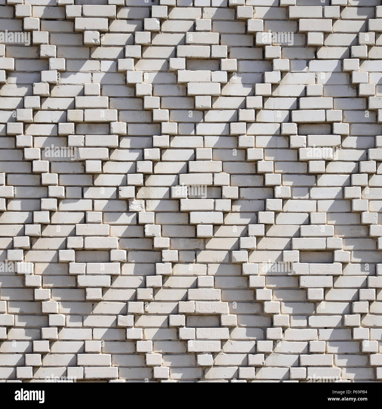 A pattern made of white bricks in the form of diamond shapes ...
