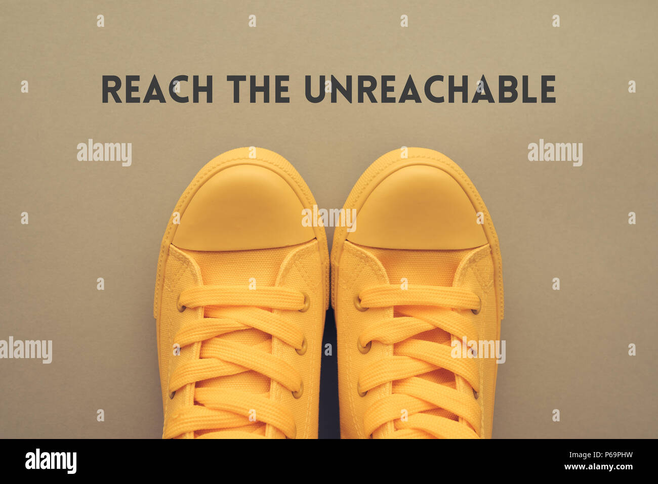 Reach the unreachable concept, young person standing over motivational ...