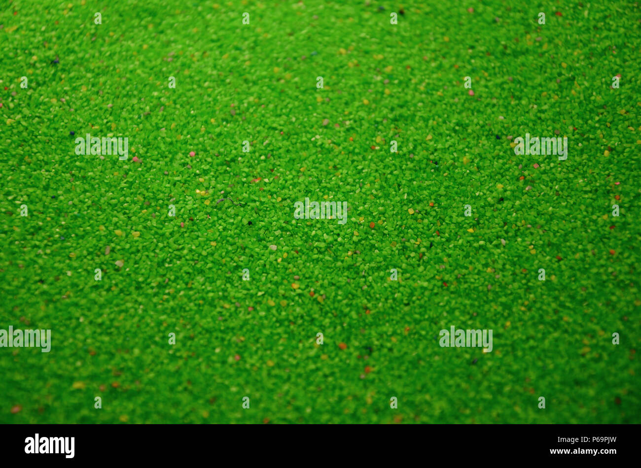 Texture of a colored granular sand close up. Green grains Stock Photo ...
