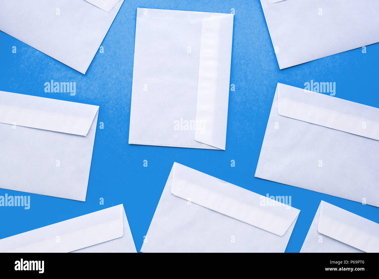 White mail envelopes mock up on blue background Stock Photo - Alamy