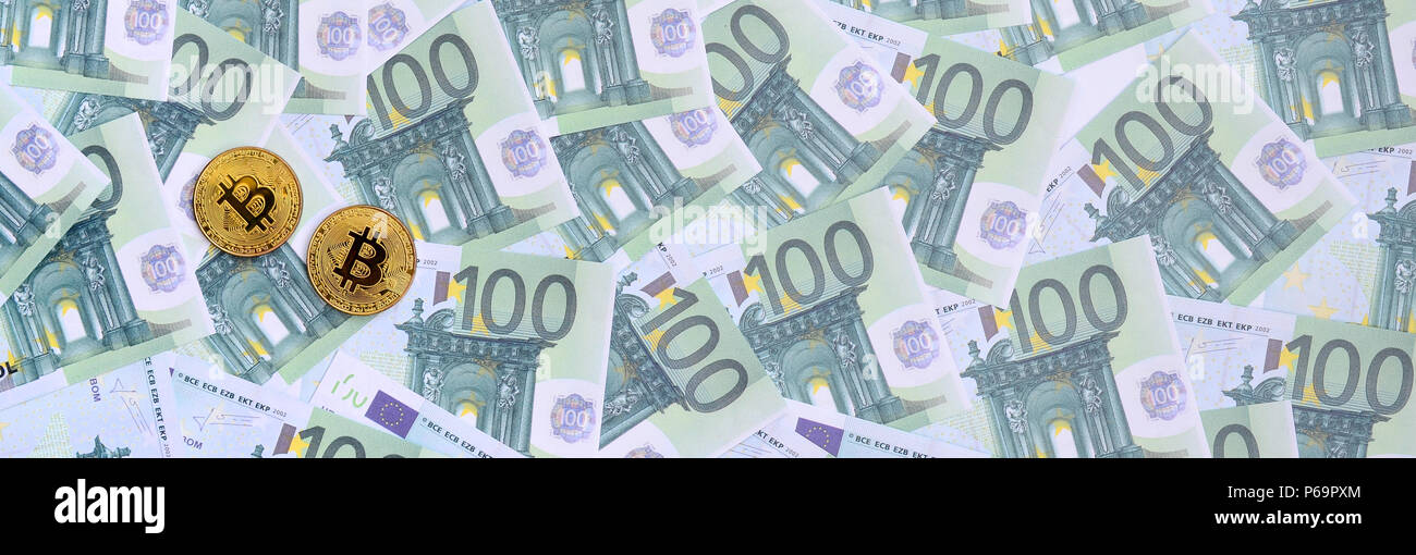 Golden physical bitcoins is lies on a set of green monetary ...