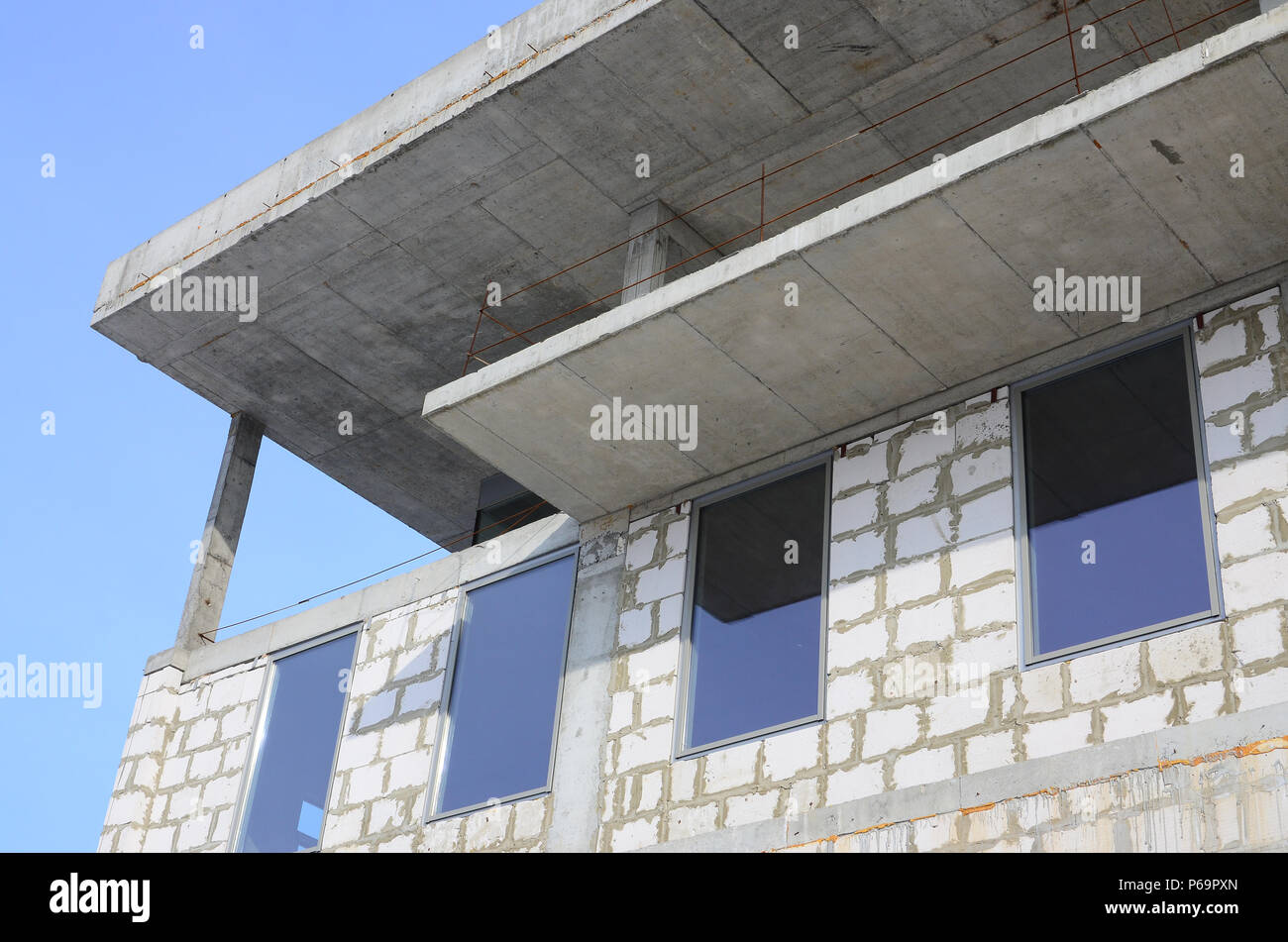 Fragment of an unfinished structure of a multi-storey building made of ...