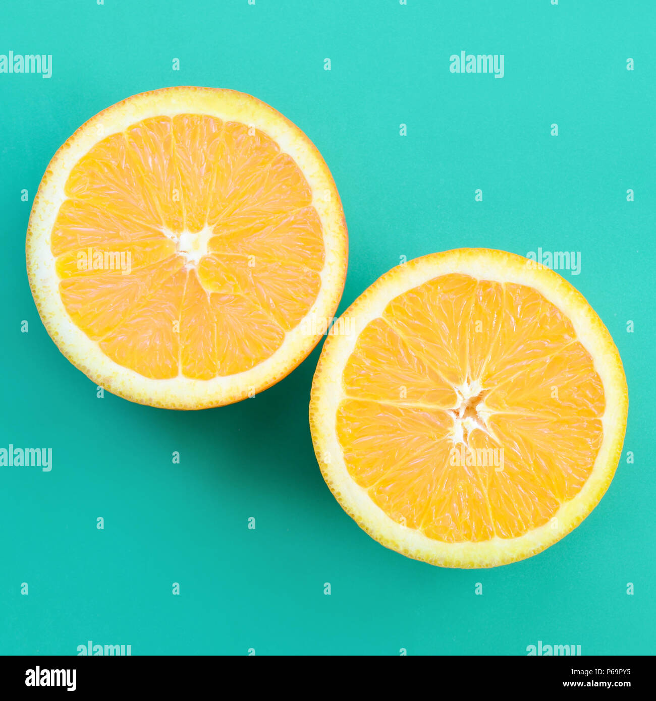 Top view of a several orange fruit slices on bright background in ...