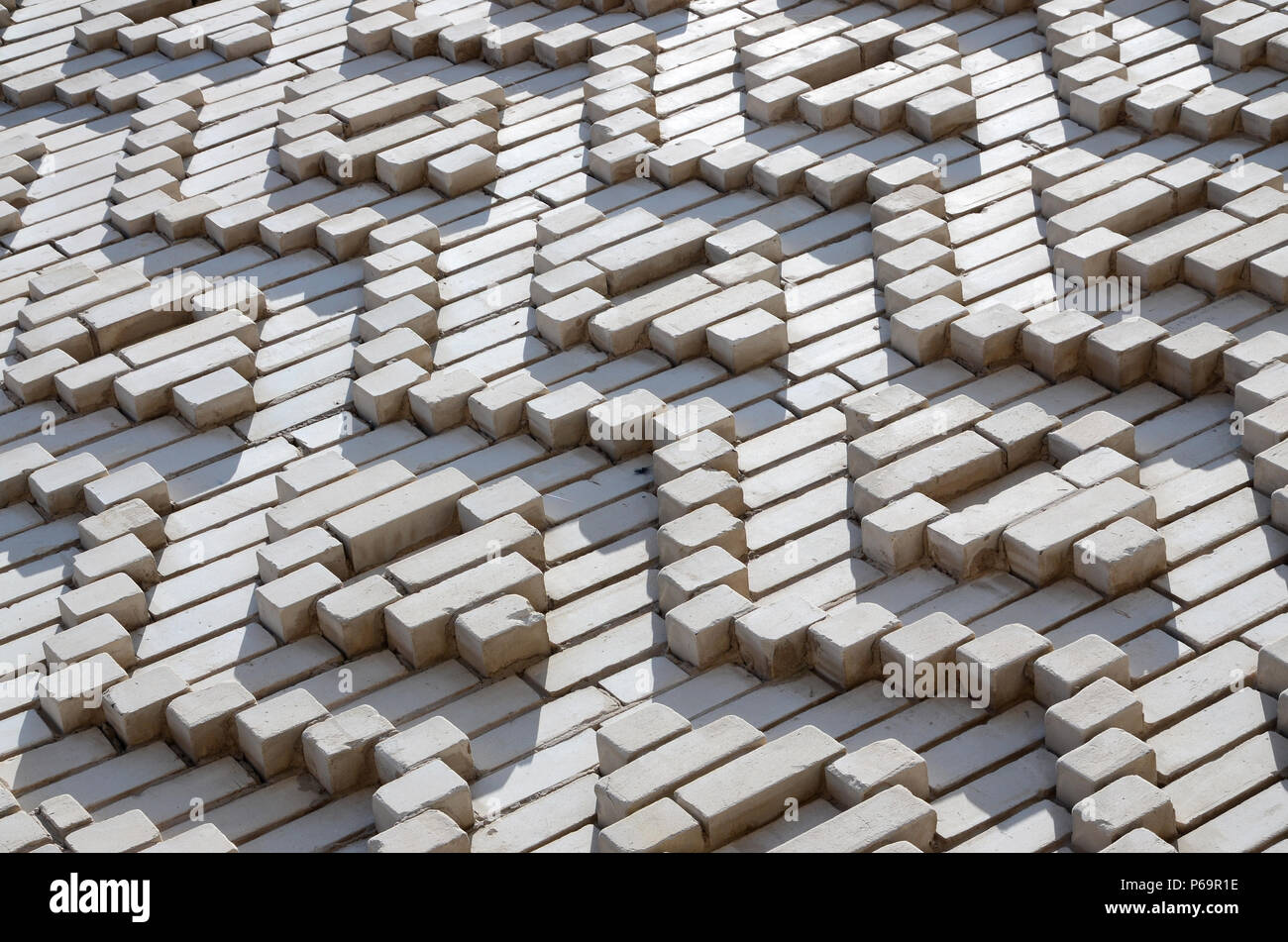 A pattern made of white bricks in the form of diamond shapes ...