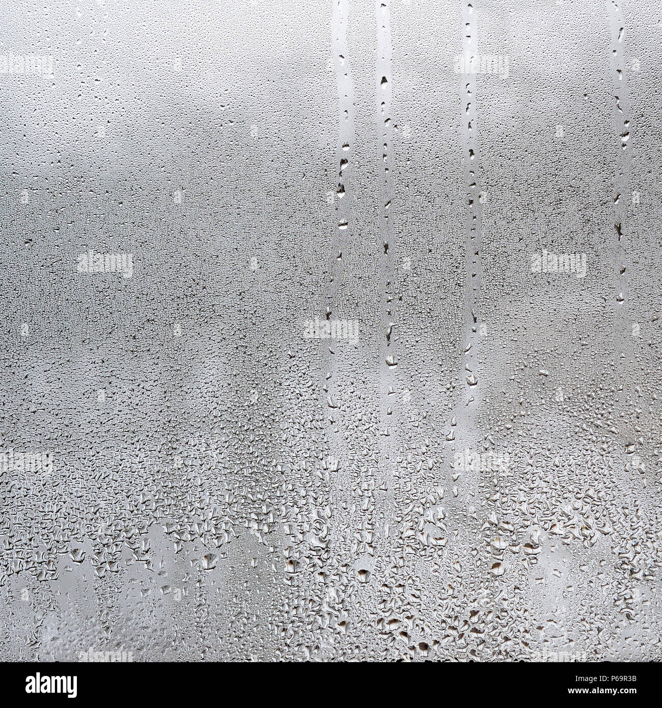 Texture of a drop of rain on a glass wet transparent background. Toned ...