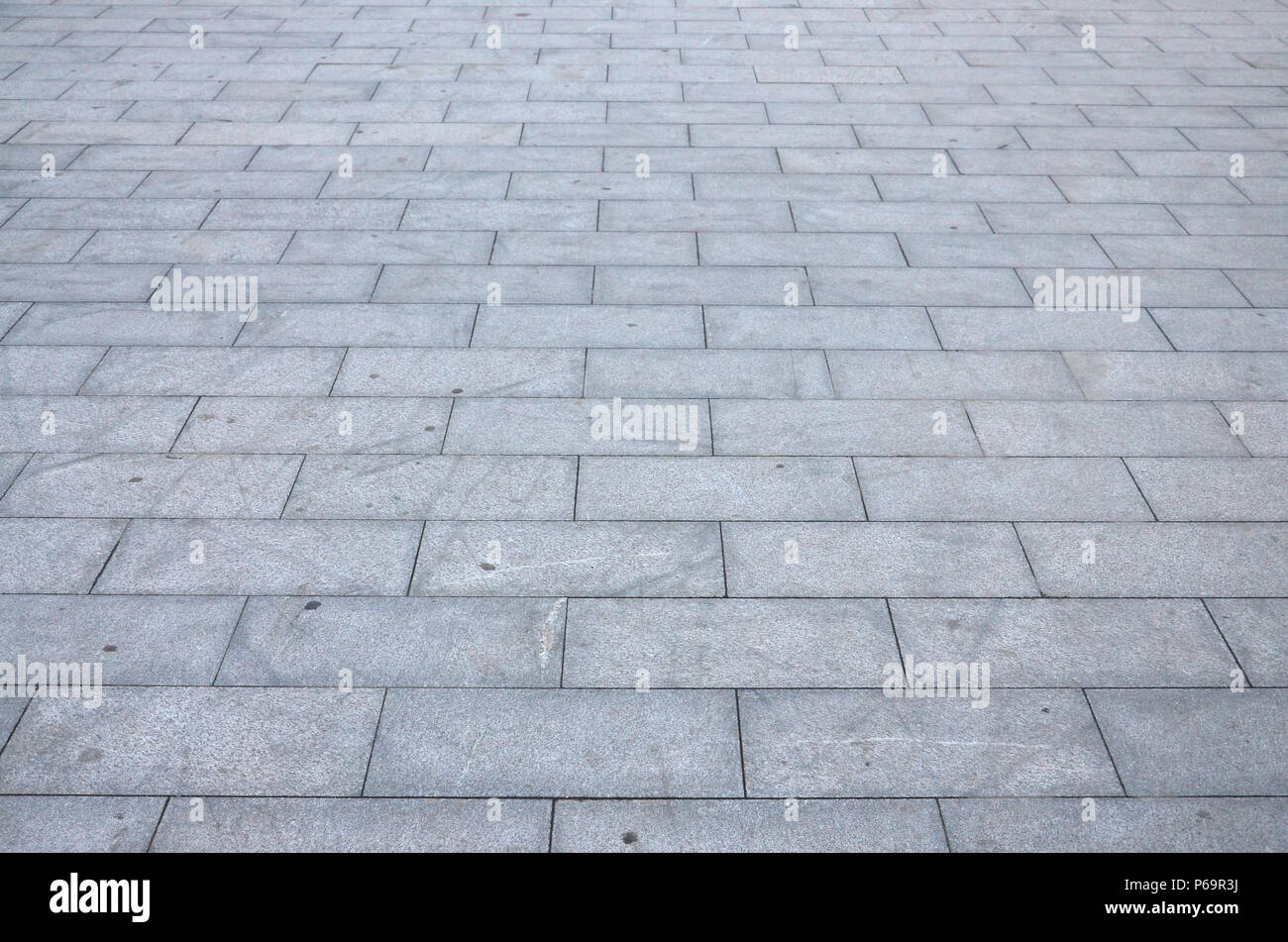 Fragment of the square paved of a large granite tiles Stock Photo - Alamy