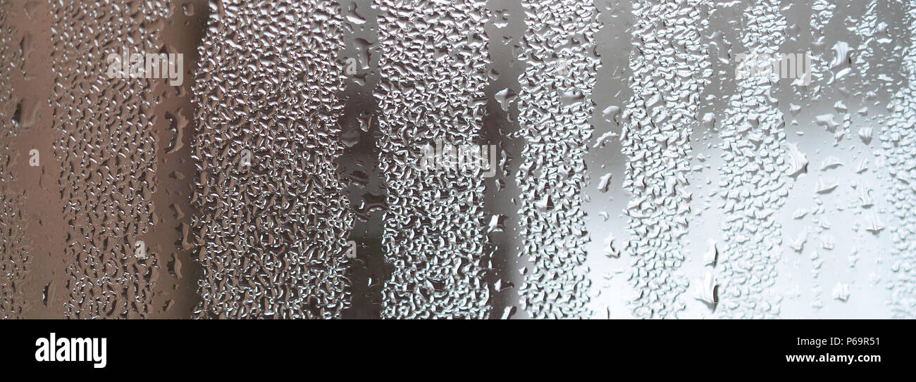 The texture of a misted glass with a lot of drops and condensation ...