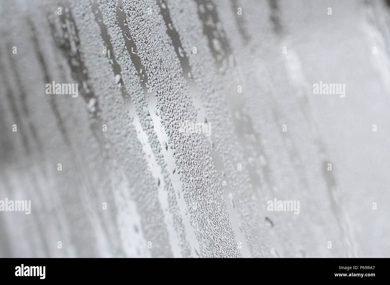 The texture of a misted glass with a lot of drops and condensation ...