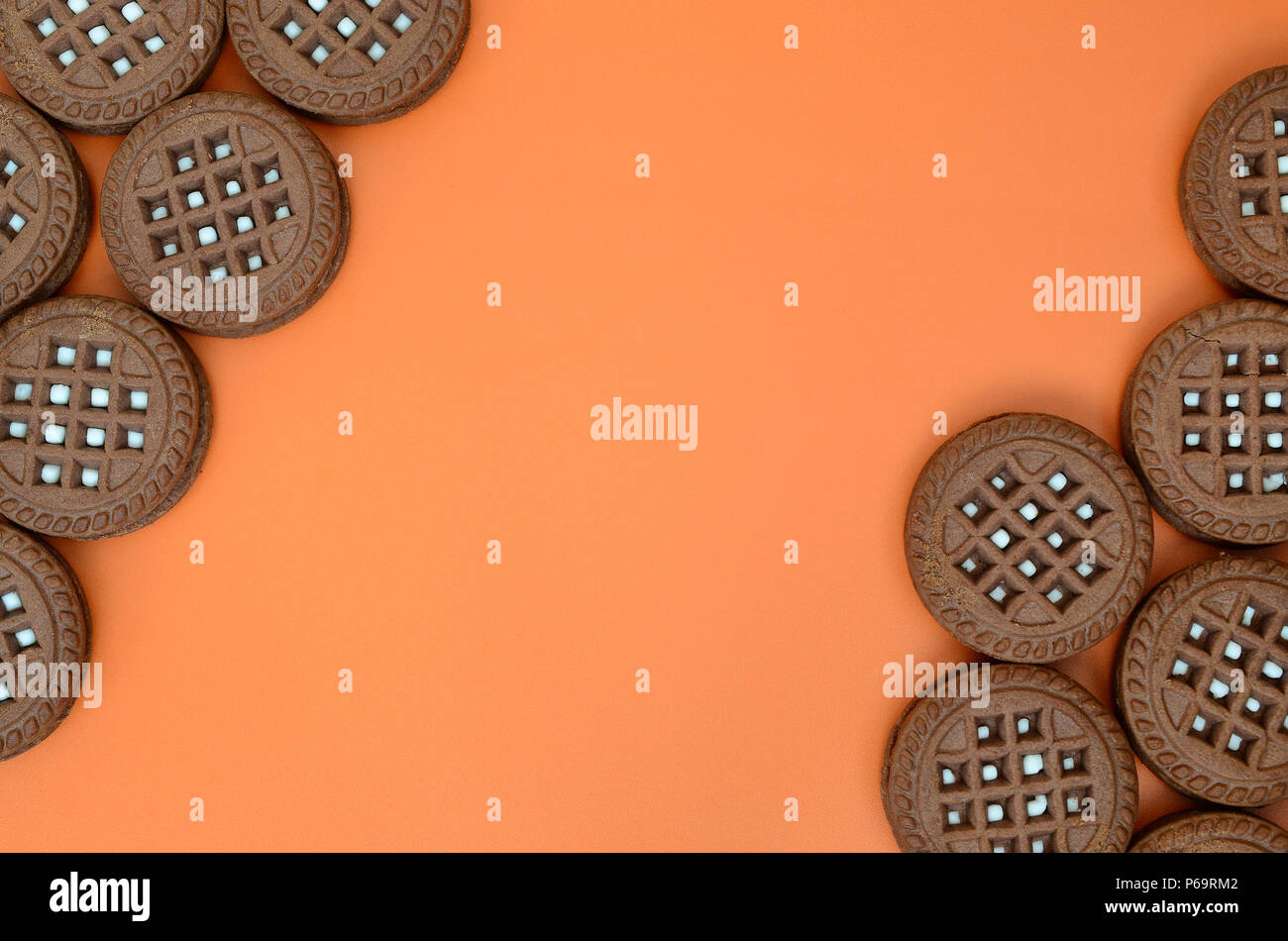 Detailed picture of dark brown round sandwich cookies with coconut ...