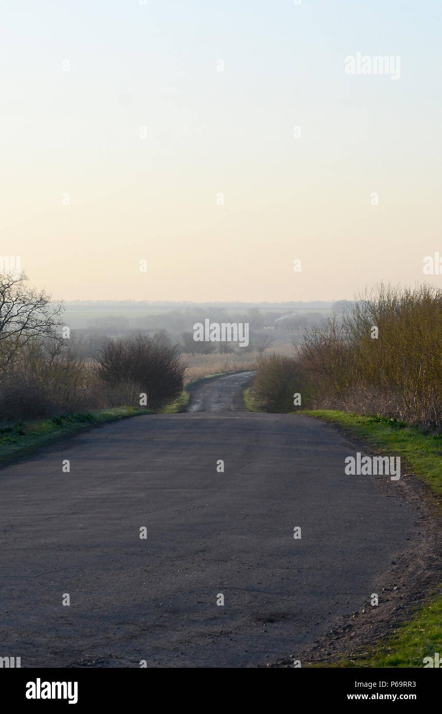 Dawn in the village asphalt road hi-res stock photography and images ...
