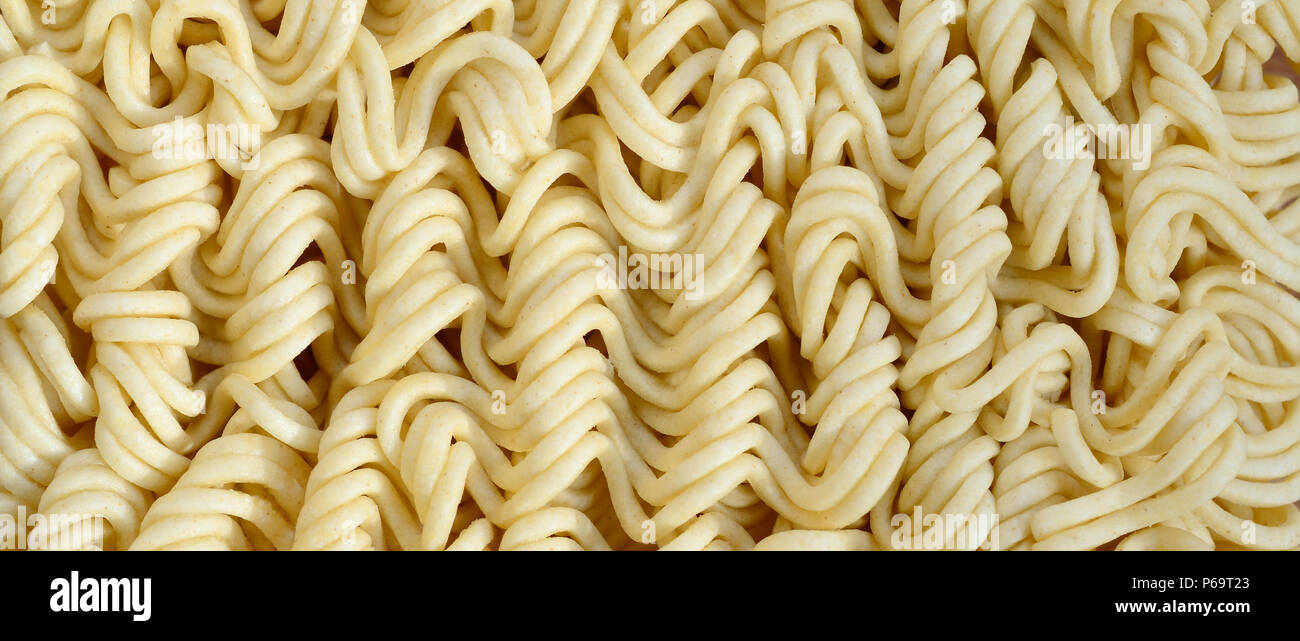 Close up view of yellow dry instant noodles. Chinese traditional food ...