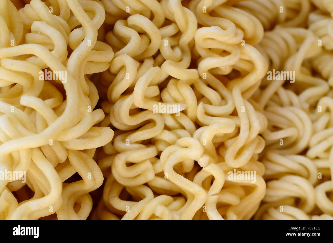 Close up view of yellow dry instant noodles. Chinese traditional food ...