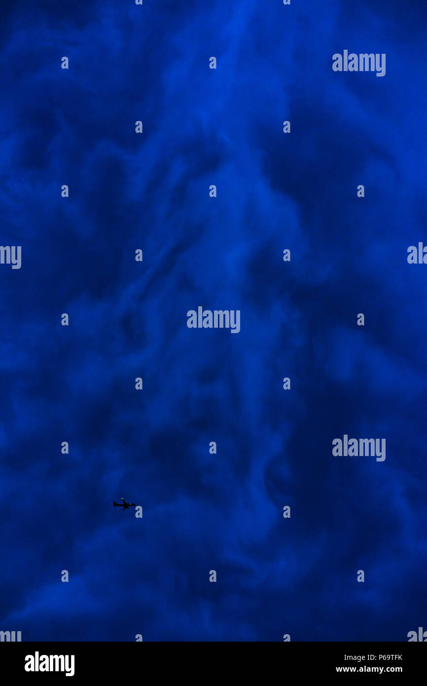 Beautiful blue dusk sky. Airplane and clouds. Nice nature and landscape ...