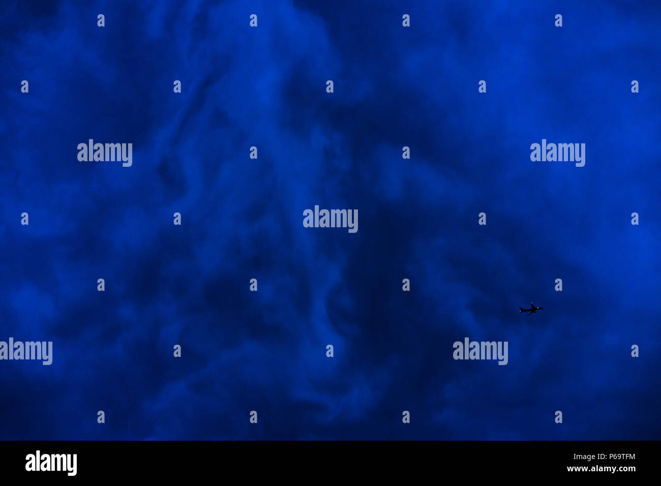 Beautiful blue dusk sky. Airplane and clouds. Nice nature and landscape ...