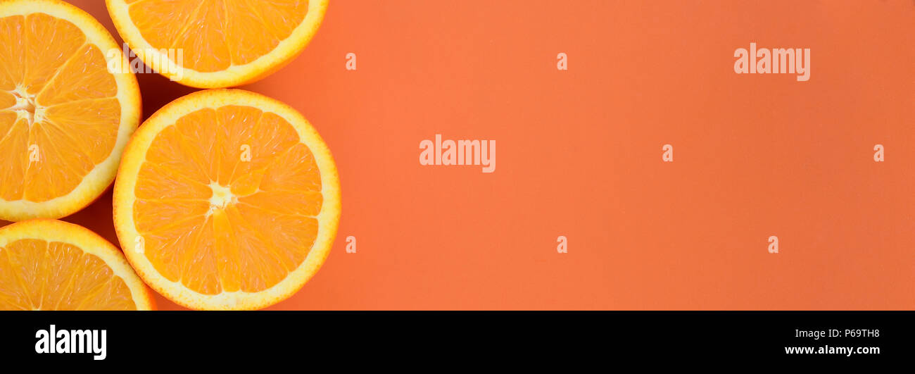 Top view of a several orange fruit slices on bright background in ...