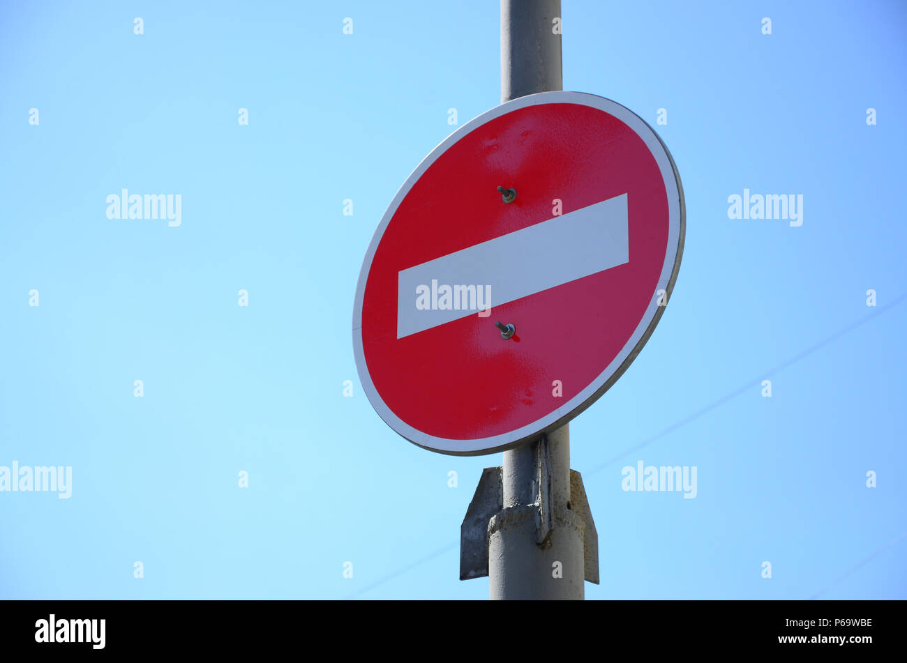 Road sign in the form of a white rectangle in a red circle. No entry ...