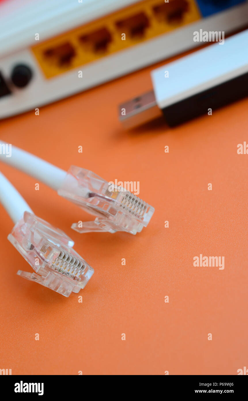 Internet router, portable USB wi-fi adapter and internet cable plugs ...