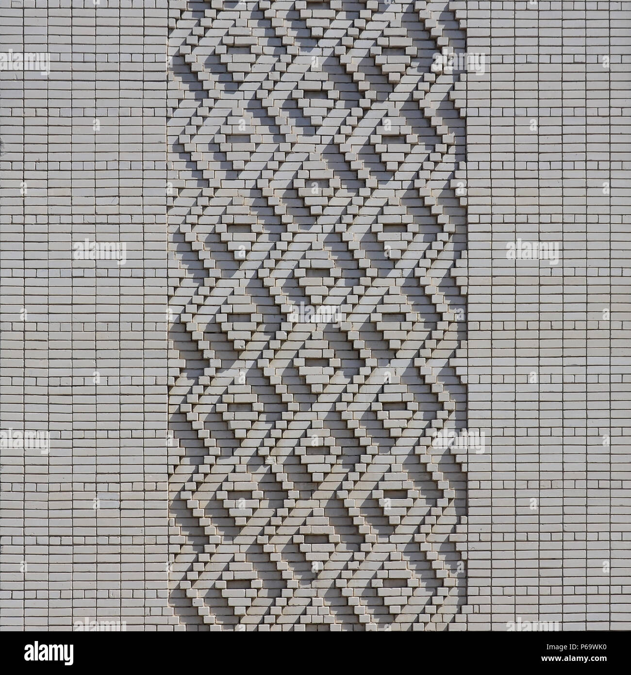 A pattern made of white bricks in the form of diamond shapes ...