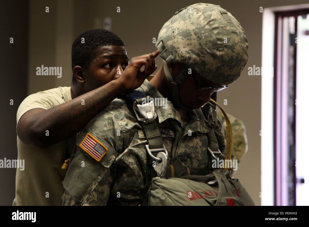 A jumpmaster assigned to 4th Military Information Support Group checks ...