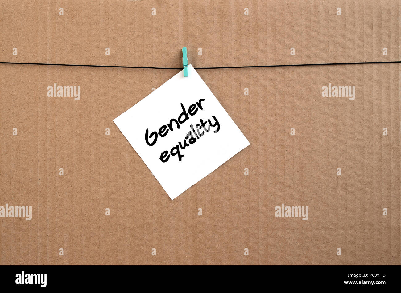 Gender equality. Note is written on a white sticker that hangs with a ...