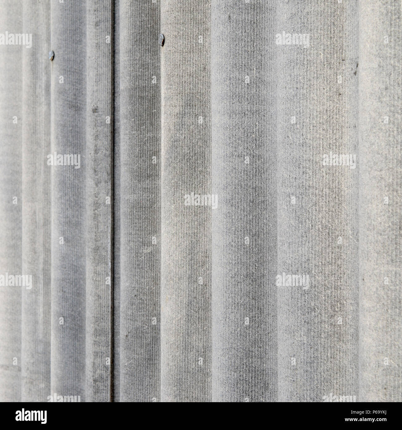 The texture of an old asbestos house roof in a village or an old ...