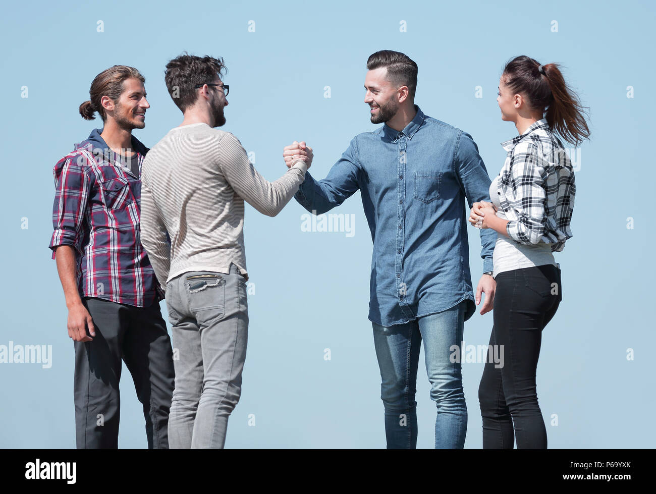 friends greet each other with a handshake Stock Photo - Alamy