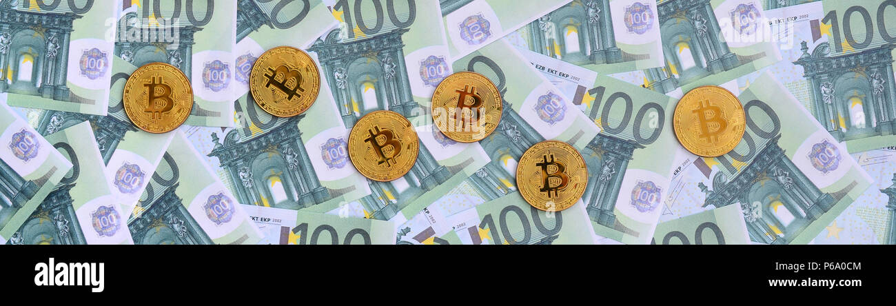 Golden physical bitcoins is lies on a set of green monetary ...